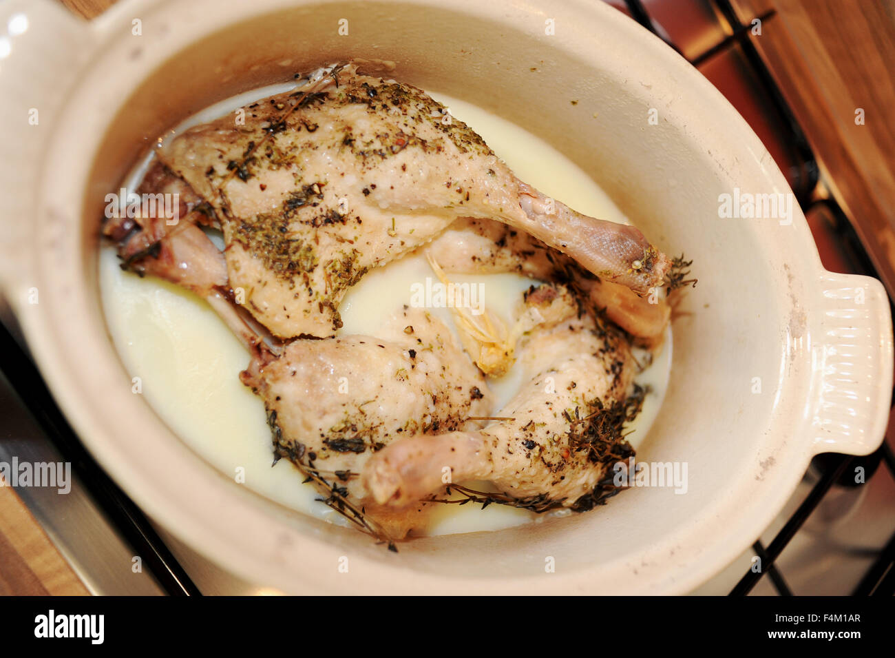 Homemade confit of duck legs cooked in duck fat Stock Photo - Alamy