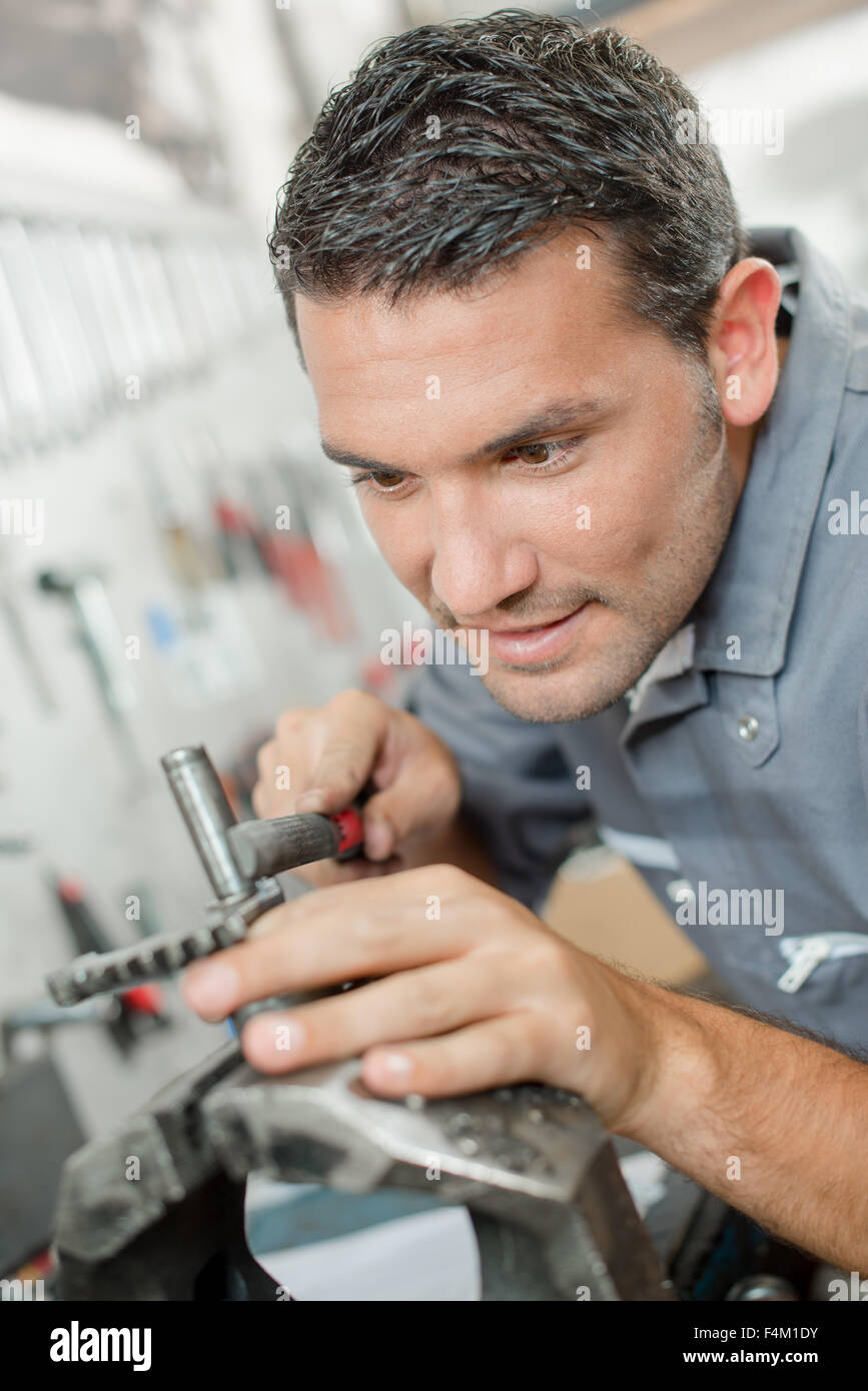 Repairing a car part Stock Photo - Alamy