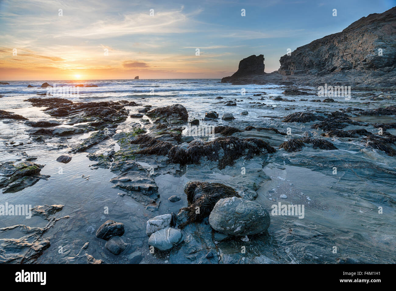 Sunset at Trevellas Coombe, a small rocky cove at St Agnes in Cornwall ...