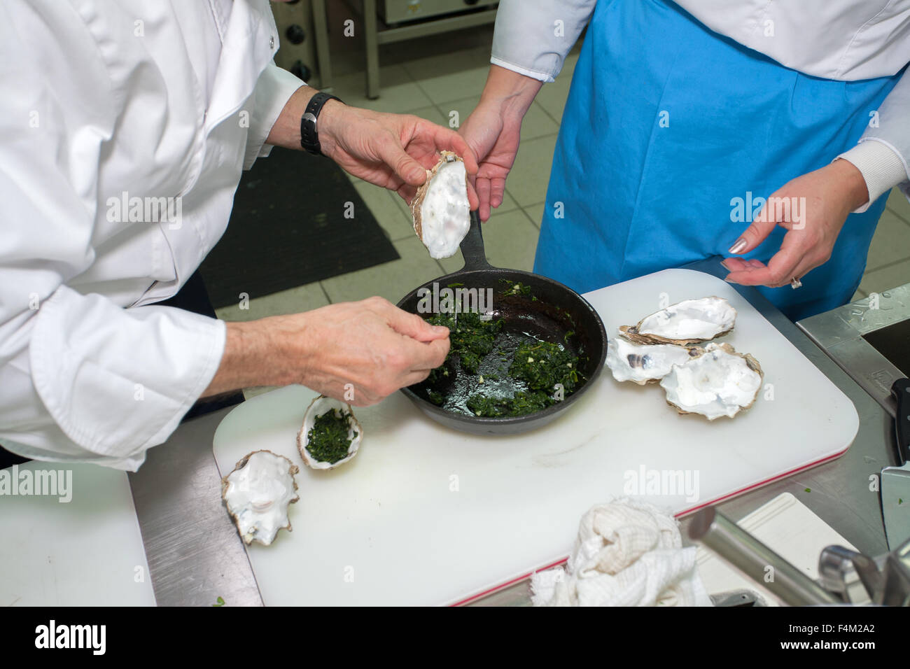 Chef cooking mussels Stock Photo - Alamy