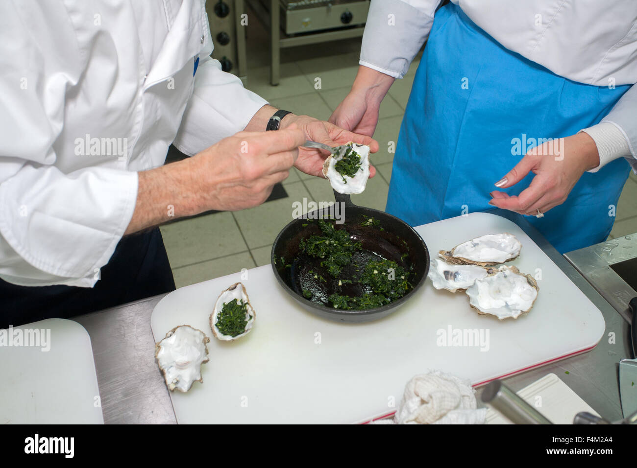 Chef cooking mussels Stock Photo - Alamy