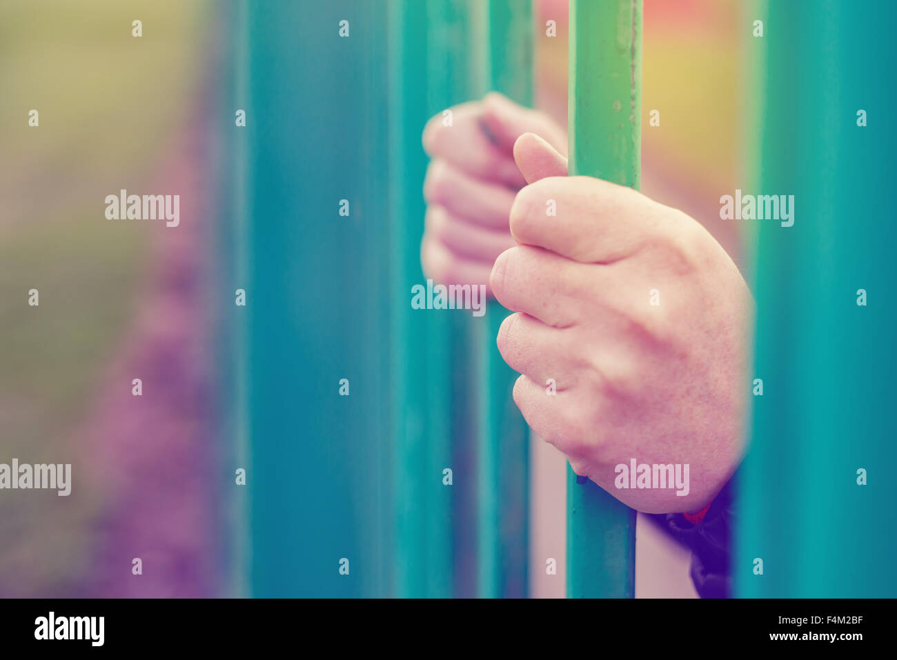 Prison bars hands woman hi-res stock photography and images - Alamy