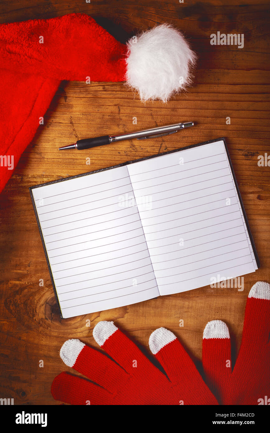 Santa Claus work desk, empty notebook as copy space for To Do list, hat ...