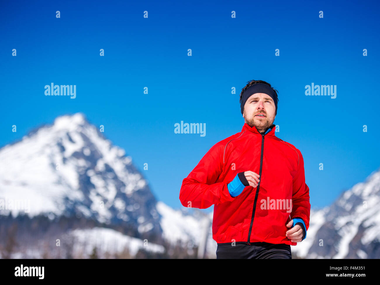 Young man jogging Stock Photo - Alamy
