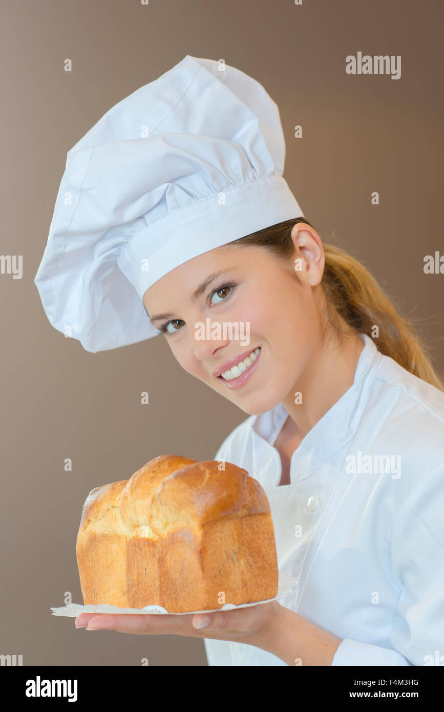 Young baker with a perfect loaf of bread Stock Photo - Alamy