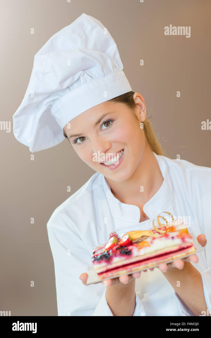 Female bakery chef with a fruit cake Stock Photo - Alamy