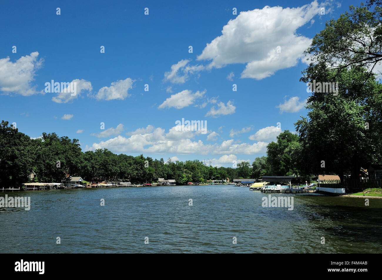 Powerboat cruising river in summer Stock Photo - Alamy