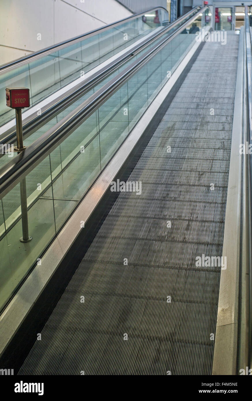 shopping center Step-less escalator with emergency stop button in red ...