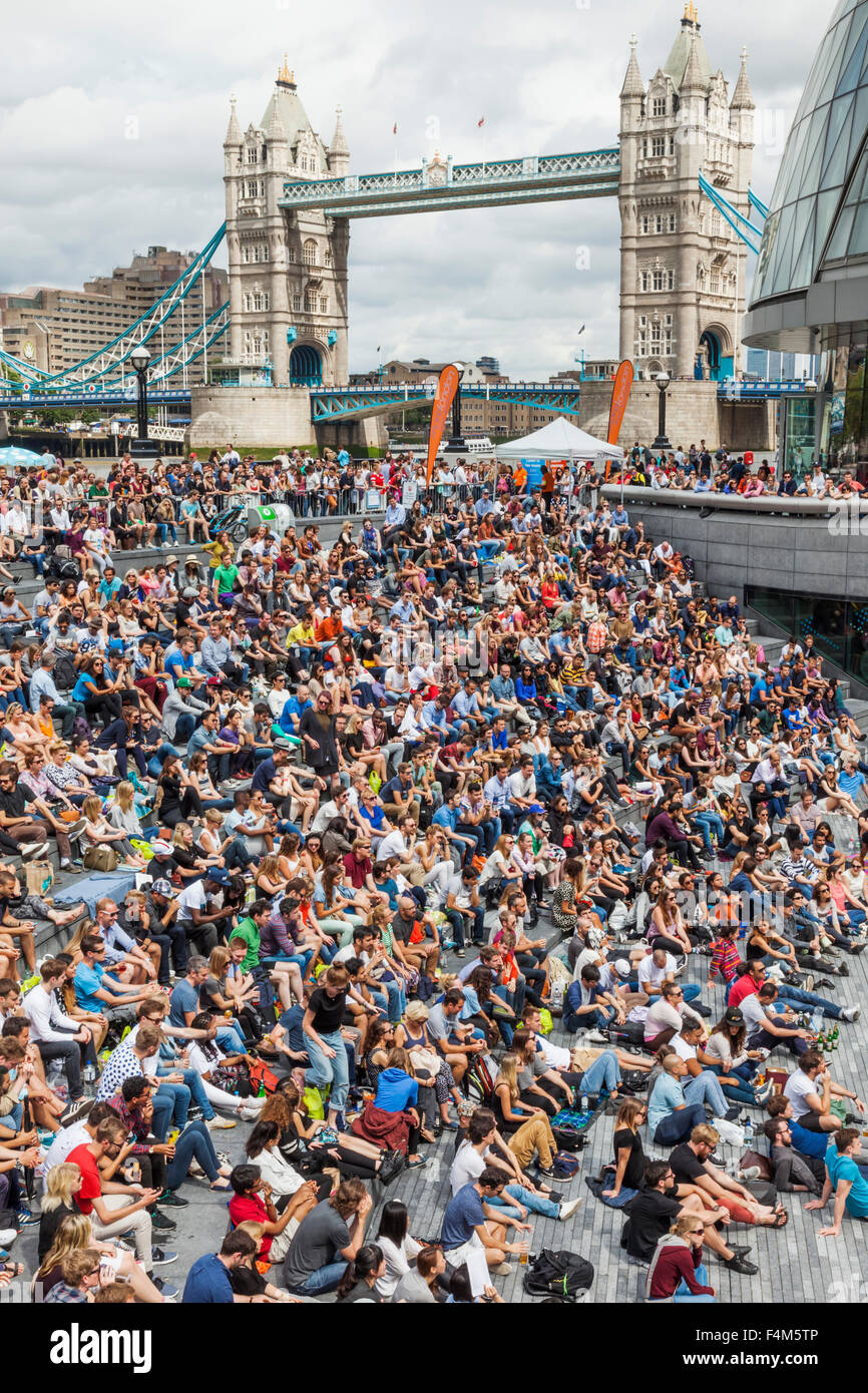 England, London, Southwark, Crowds in The Scoop Amphitheatre and Tower ...