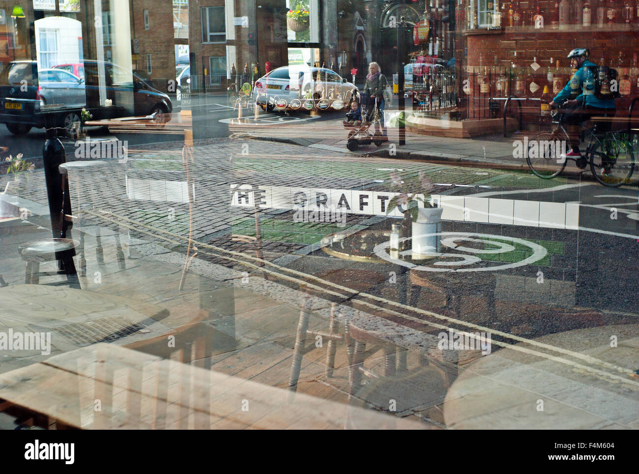 reflection of street scene in window of The Grafton Pub Kentish Town ...