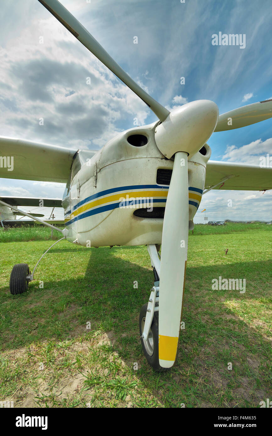 Small private plane parked on the airfield Stock Photo - Alamy