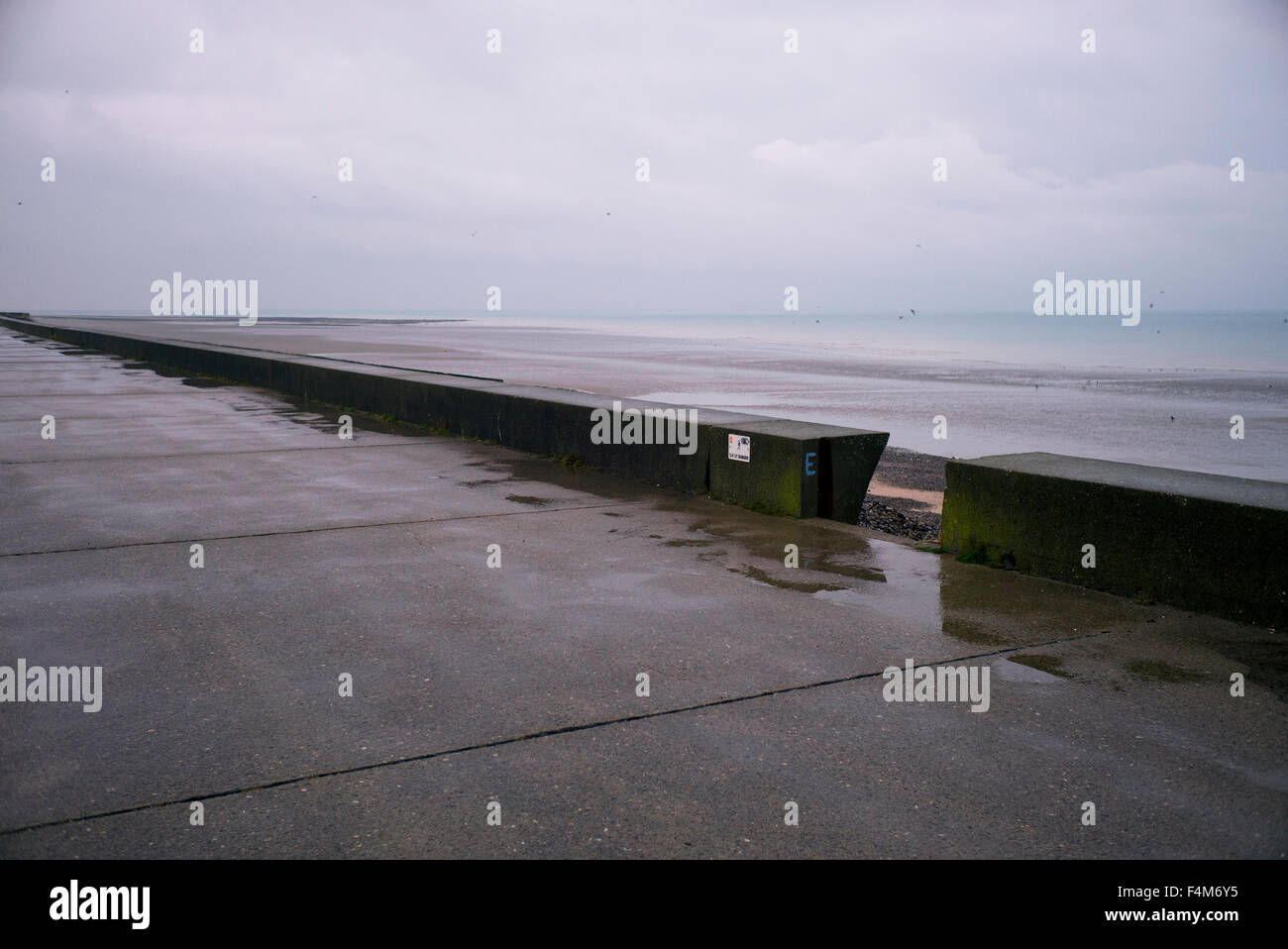 Sea wall in the rain, empty beach, Normandy, France Stock Photo - Alamy