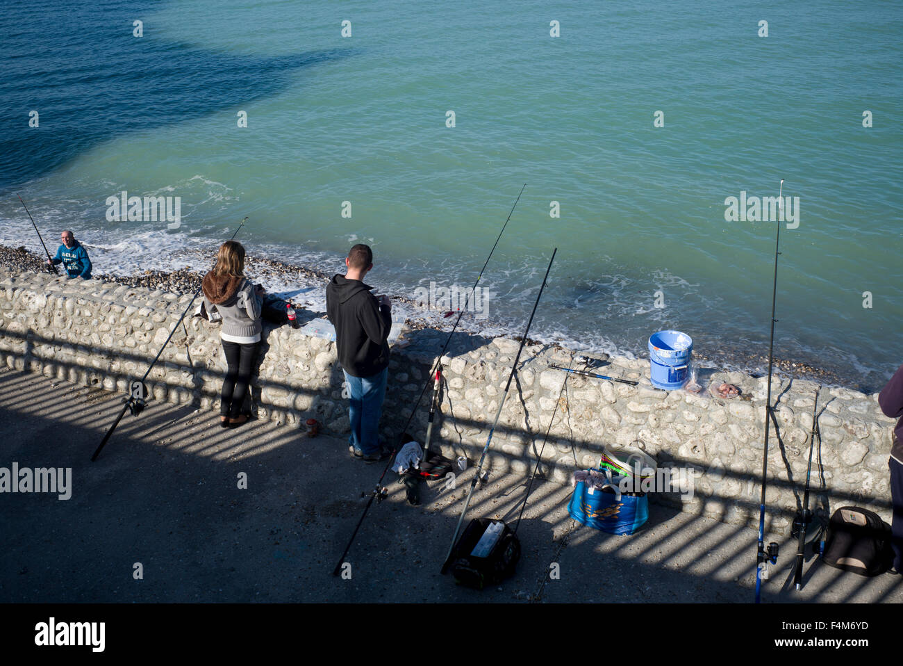 Fishing off sea wall hi-res stock photography and images - Alamy
