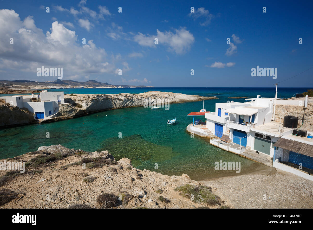 Traditional boat houses and fishing boats in Mytakas, Milos island ...