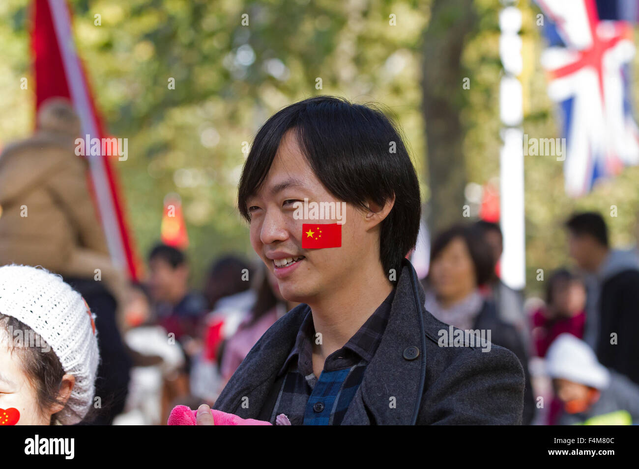 London, UK. 20th October, 2015. Chinese man with his face painted in ...