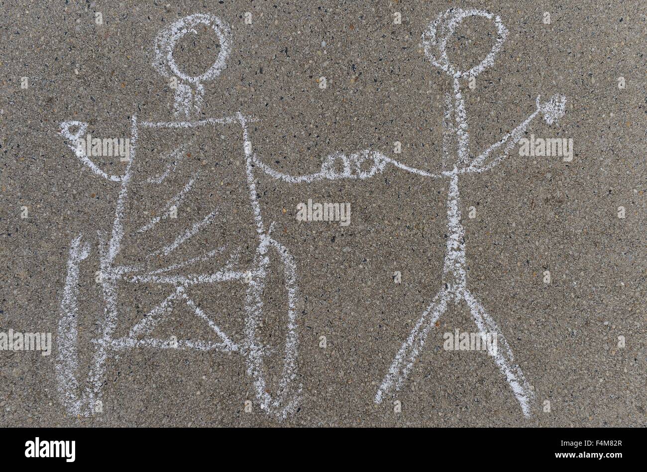 A chalkdrawing that shows a handicapped person and a non handicapped ...