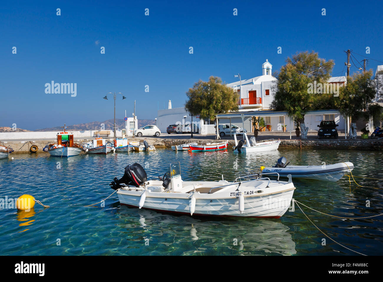 Harbour and a church in Pollonia village in Milos island, Greece Stock ...