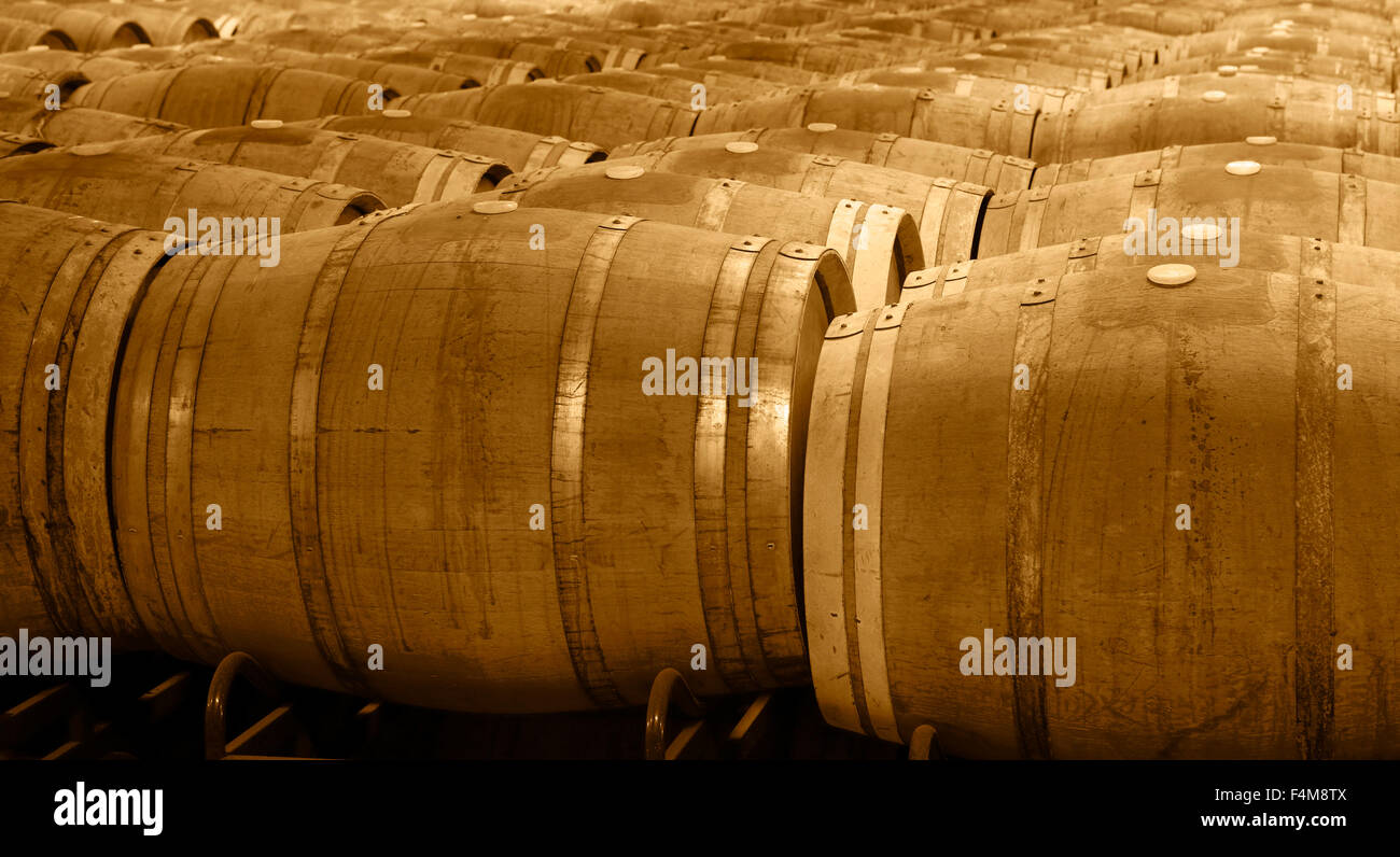 Wine barrels in an aging process at spanish cellar Stock Photo - Alamy