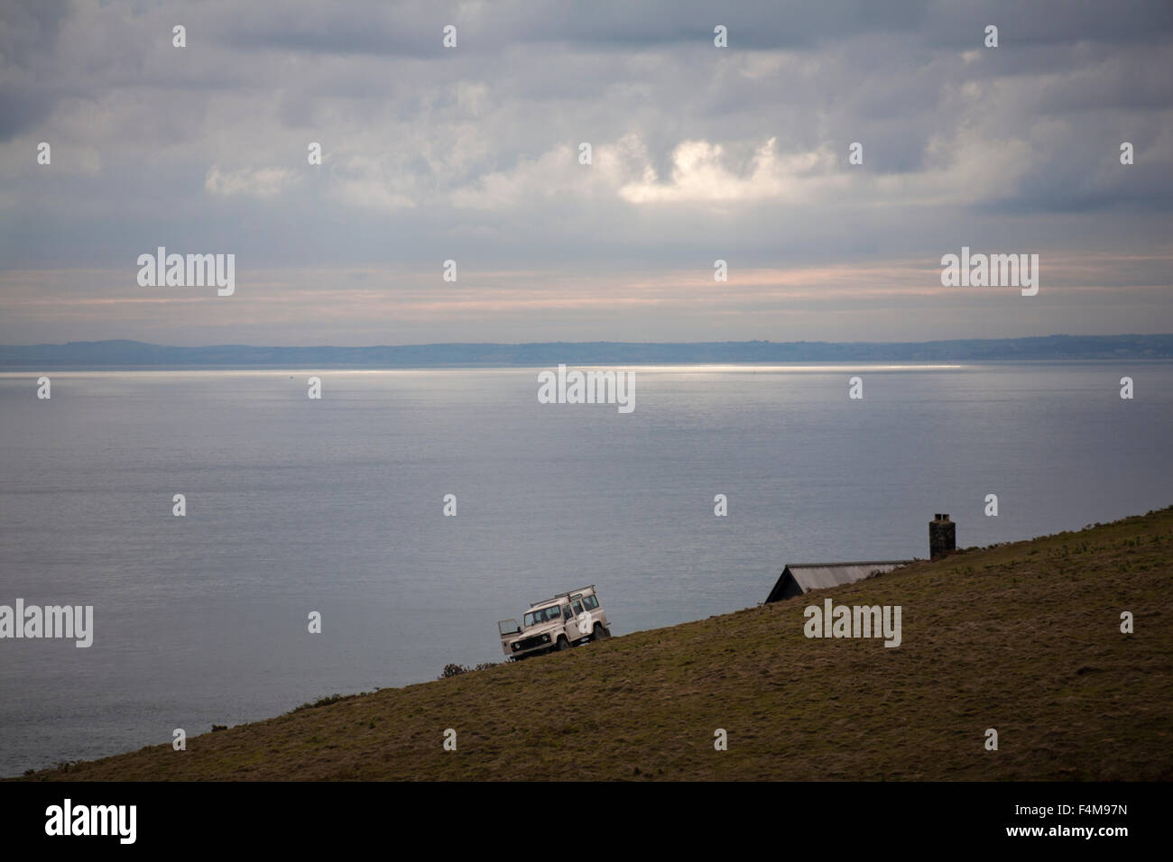 Land rover on Lundy Island with light hitting the Bristol Channel ...