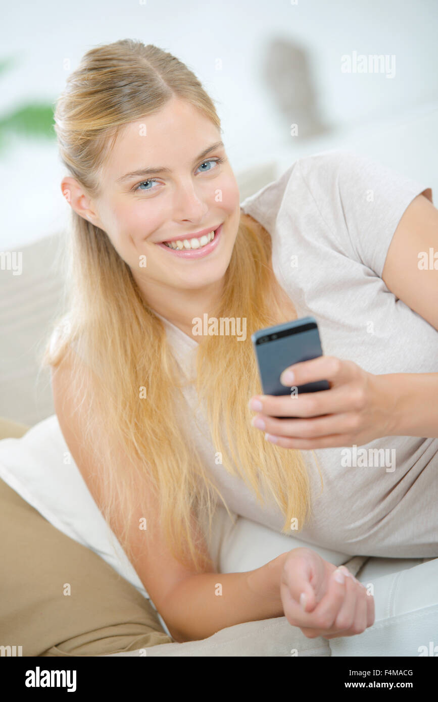 Woman checking her email on her phone Stock Photo - Alamy