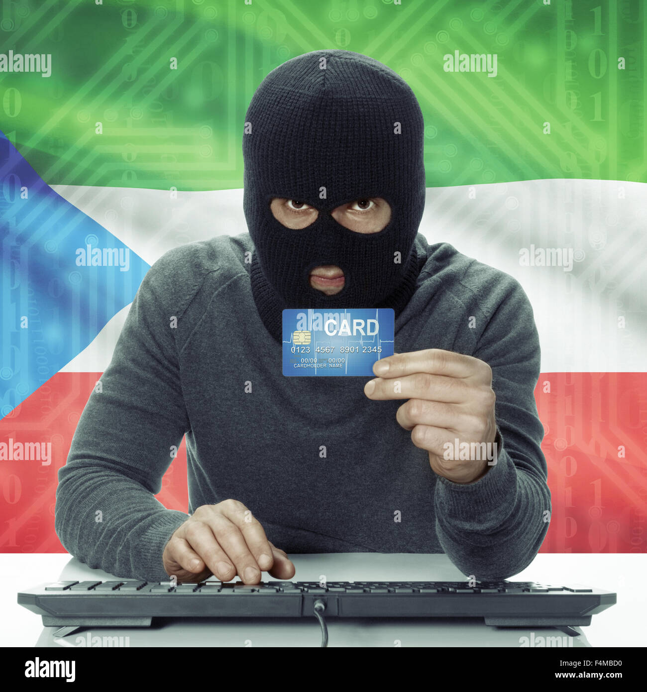 Dark-skinned hacker with credit card in hand and flag on background ...