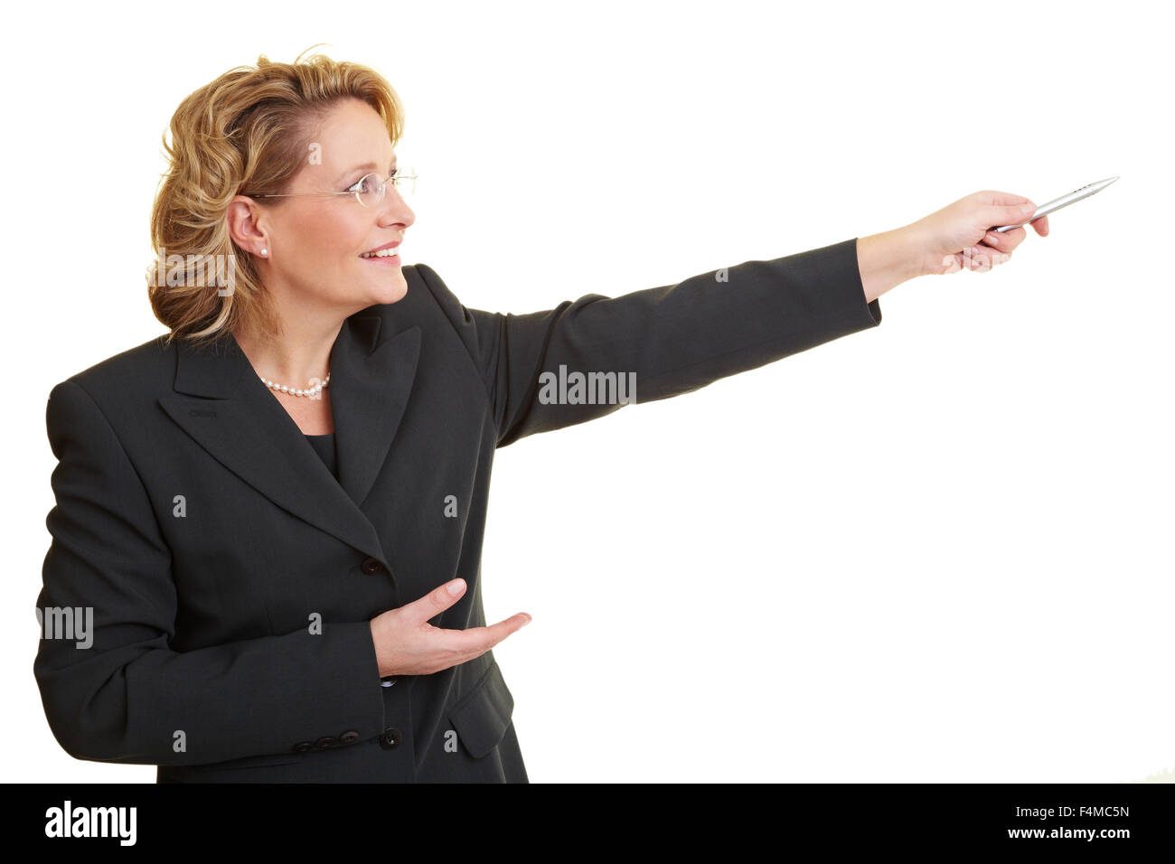 Business woman pointing with her pen rightward Stock Photo - Alamy