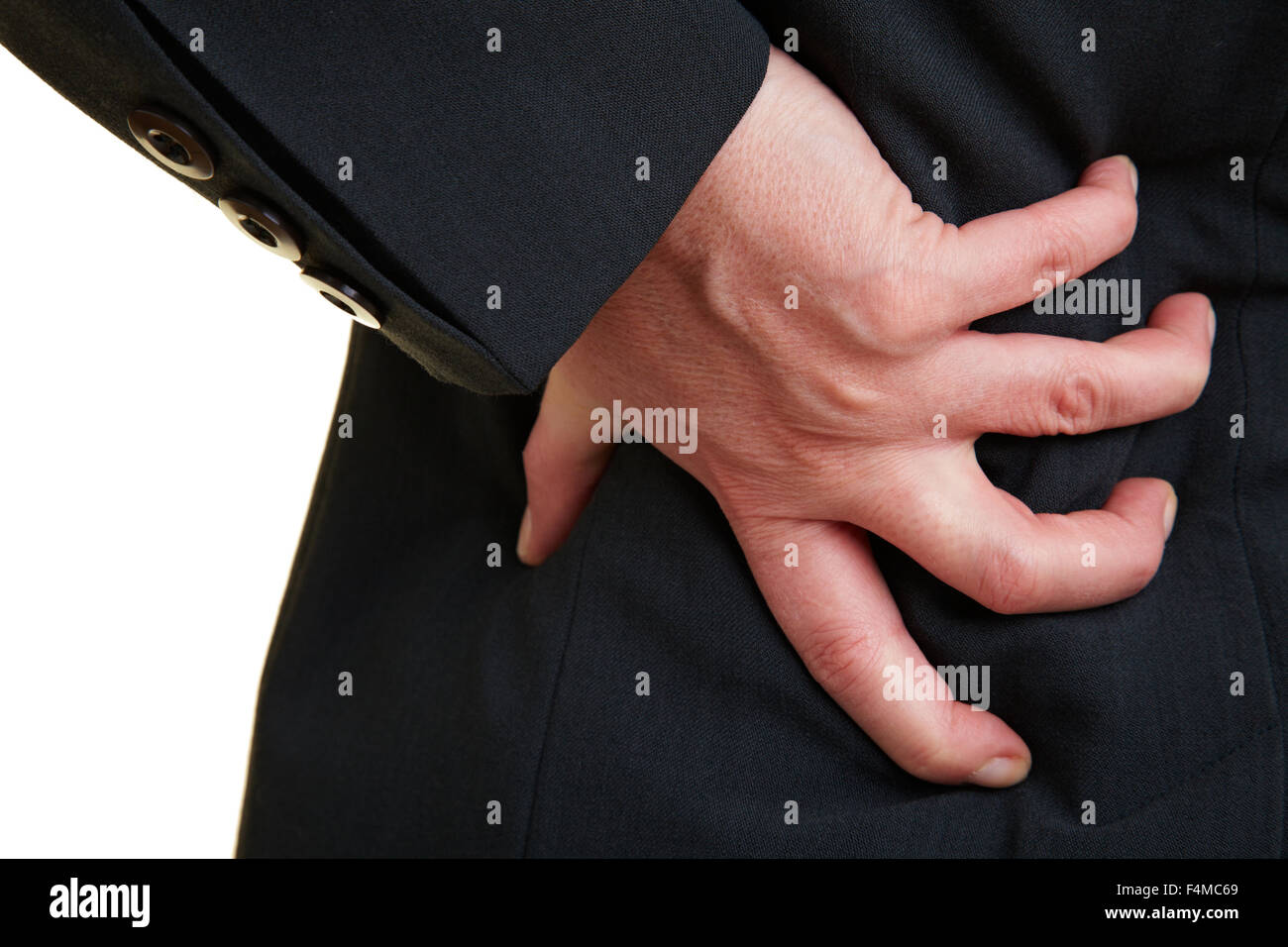 Business woman holding her hand on her back Stock Photo - Alamy