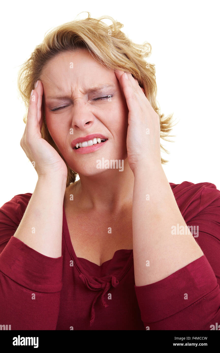 Woman holding her hands on her twitching temples Stock Photo - Alamy
