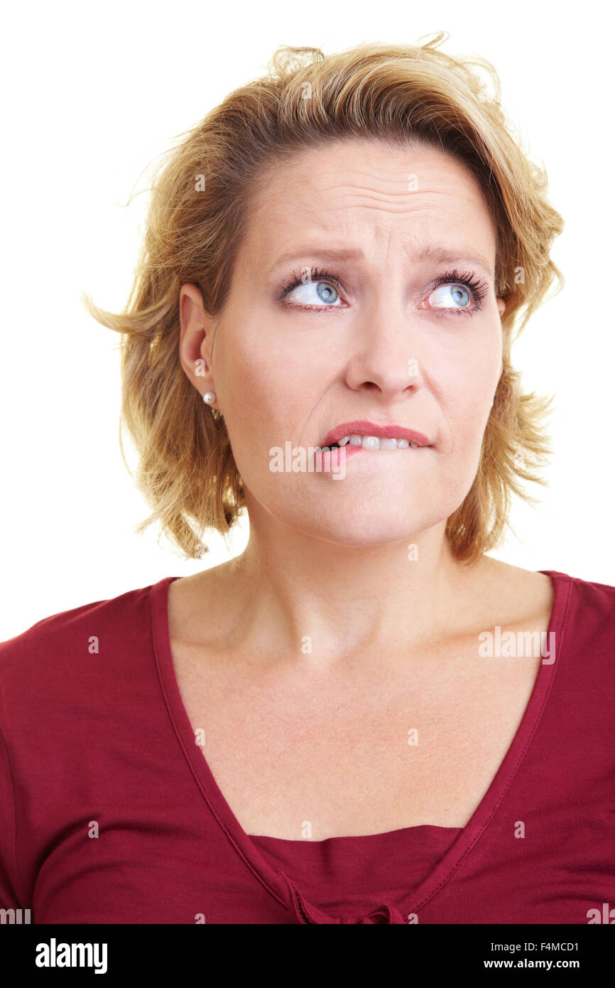 Shy woman biting lip hi-res stock photography and images - Alamy