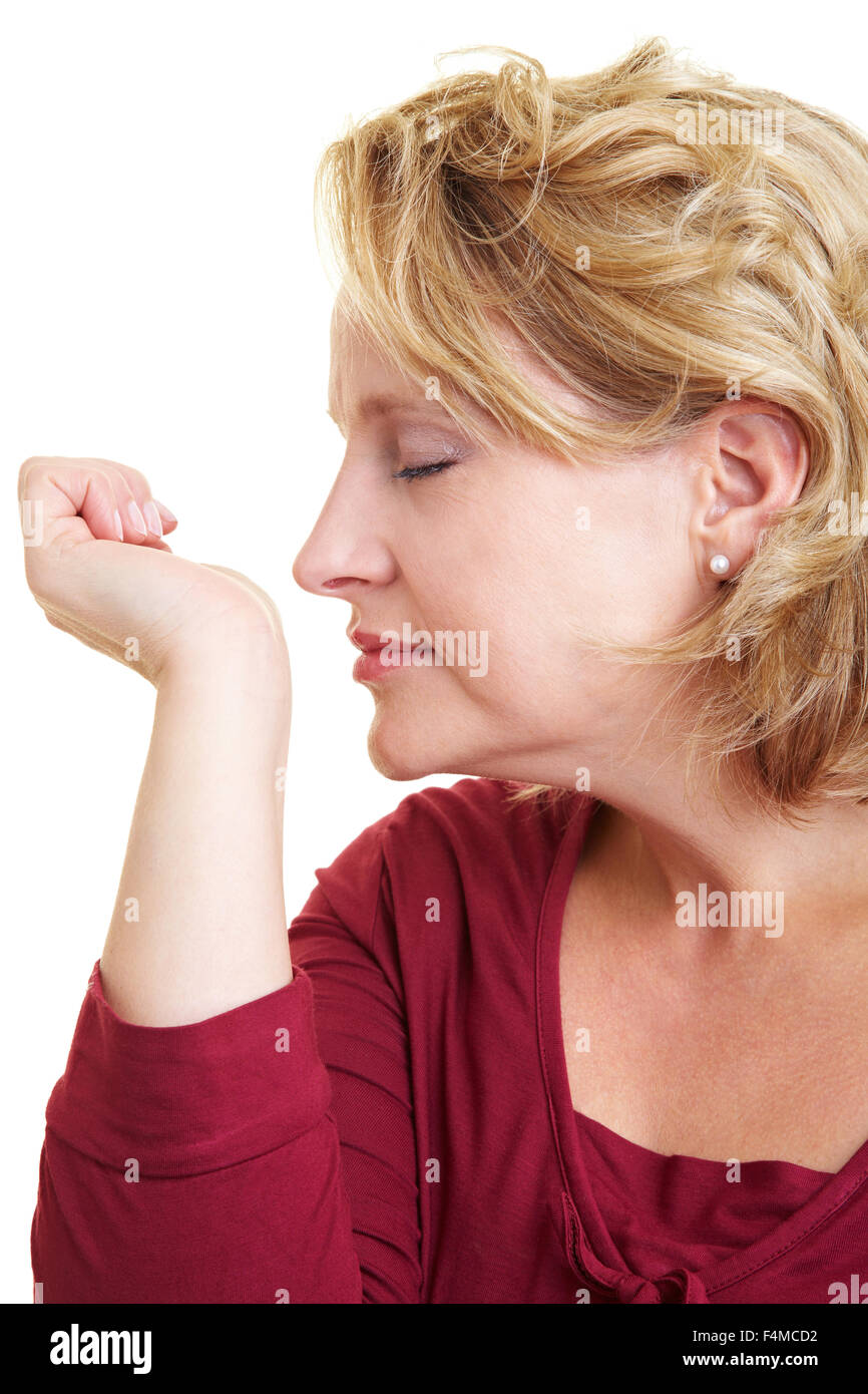 Woman sampling a fragrance on her hand pulse Stock Photo - Alamy