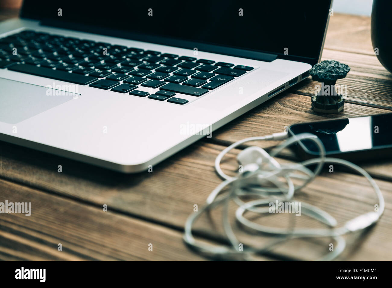 Workplace with open laptop on modern wooden desk Stock Photo - Alamy