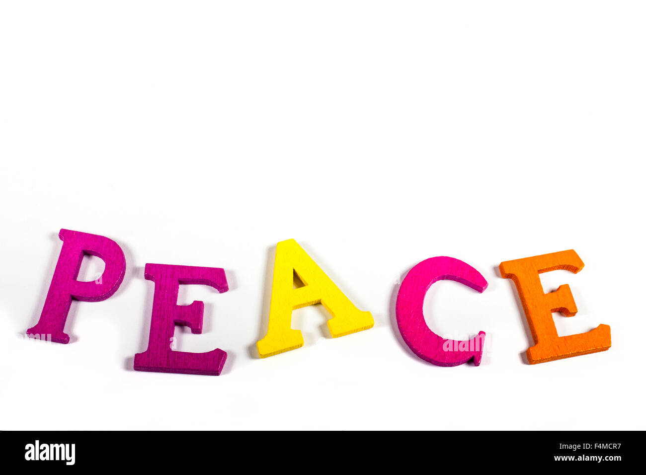 PEACE spelt out with bright coloured letters over a white background ...