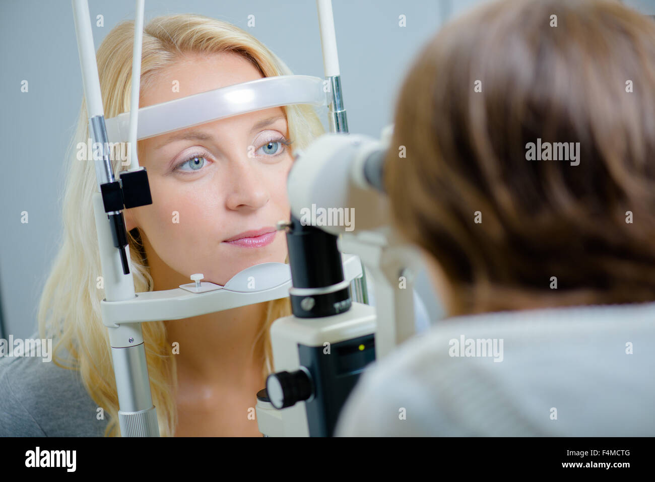Woman having eye test Stock Photo - Alamy