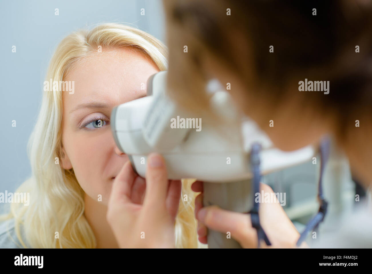 lady having eye examination Stock Photo - Alamy