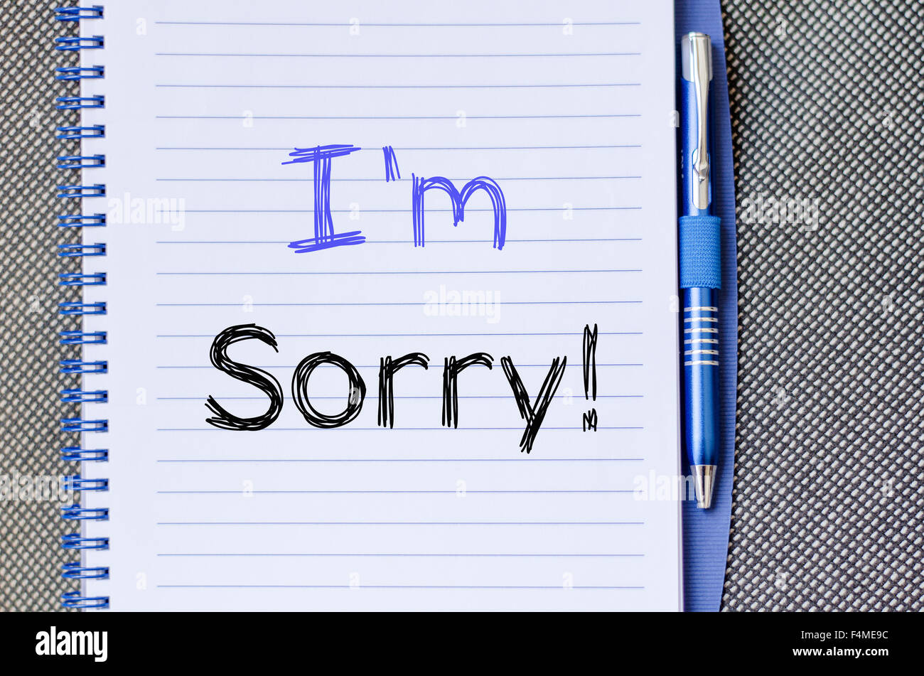 I'm sorry text concept write on notebook Stock Photo - Alamy
