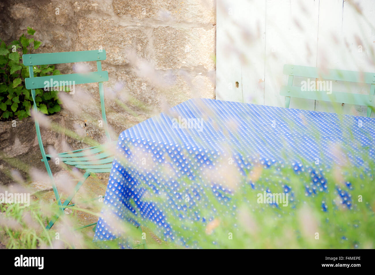 Street scene with table and seats in a small town in provence france ...