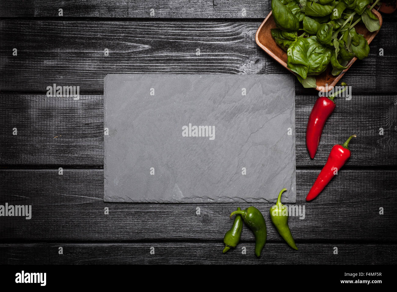Stone board with different spices Stock Photo - Alamy