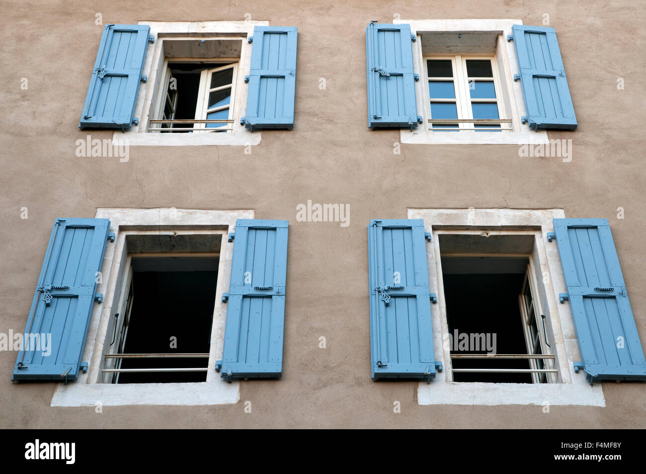 Four windows with blue shutters in Provence France Europe Stock Photo ...