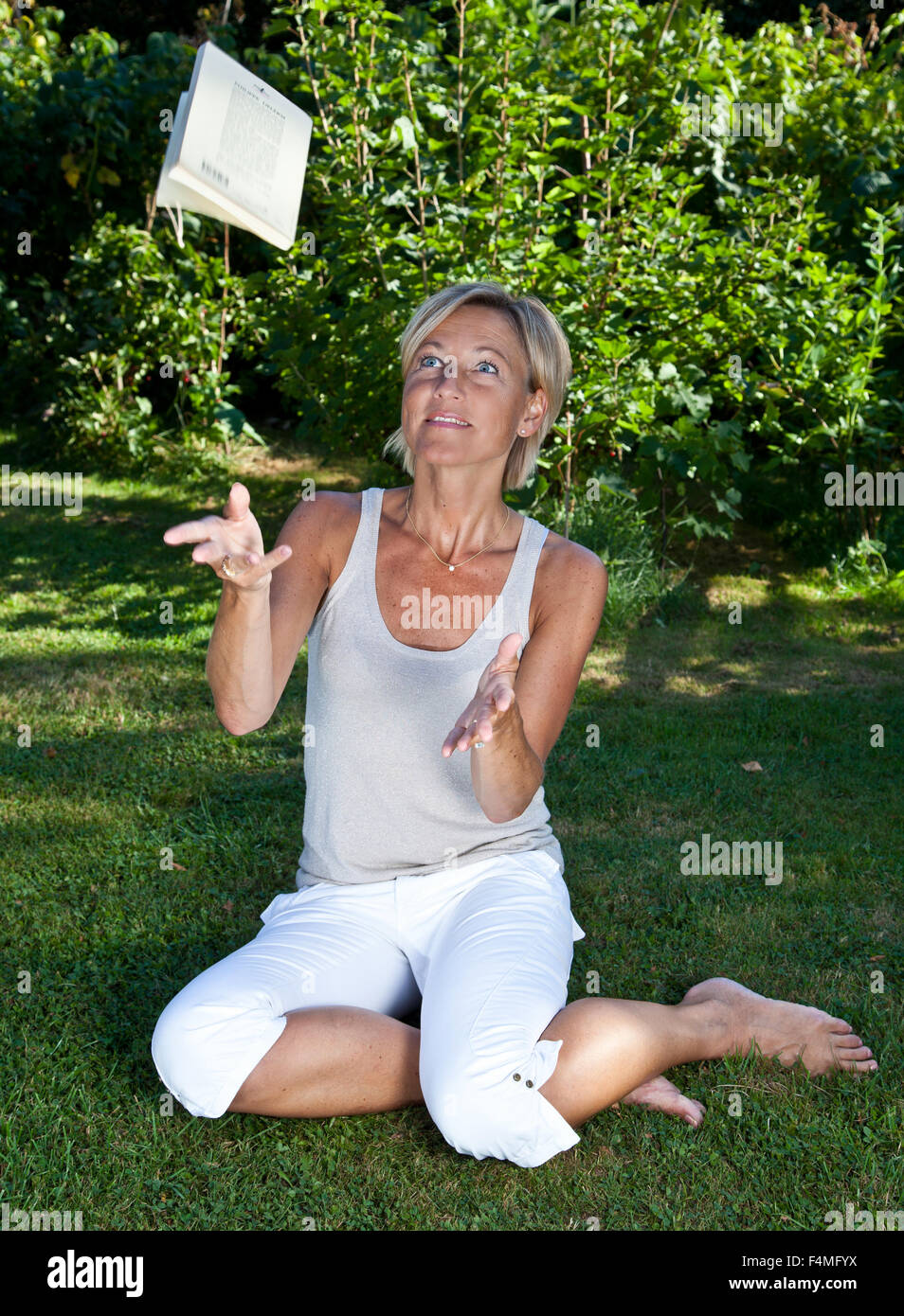 Throwing book hi-res stock photography and images - Alamy