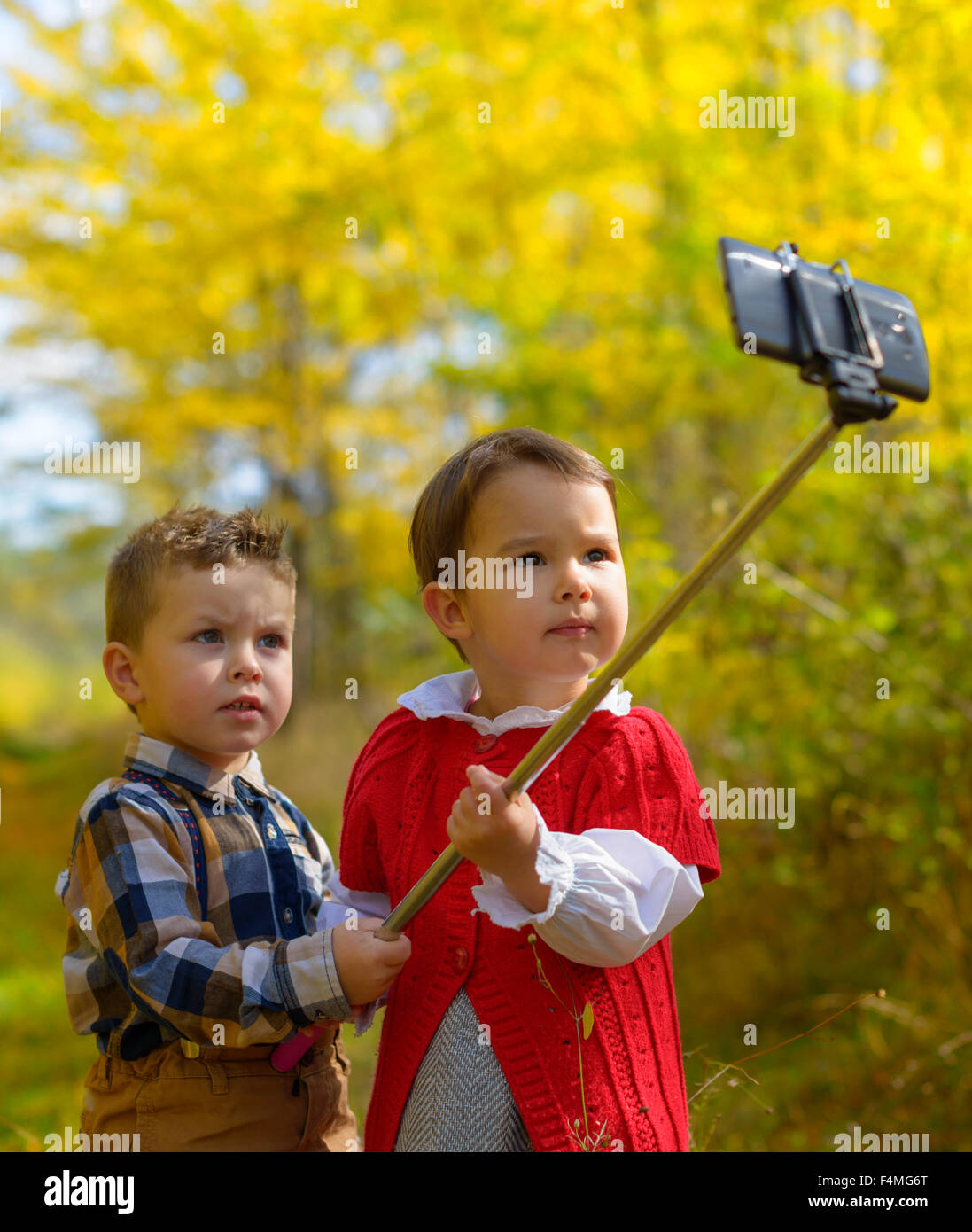 Two little kids taking selfie in park Stock Photo - Alamy