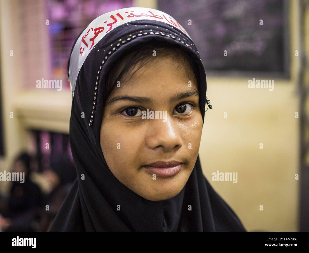 Yangon Division, Myanmar. 20th Oct, 2015. A Shia Muslim woman waits for ...