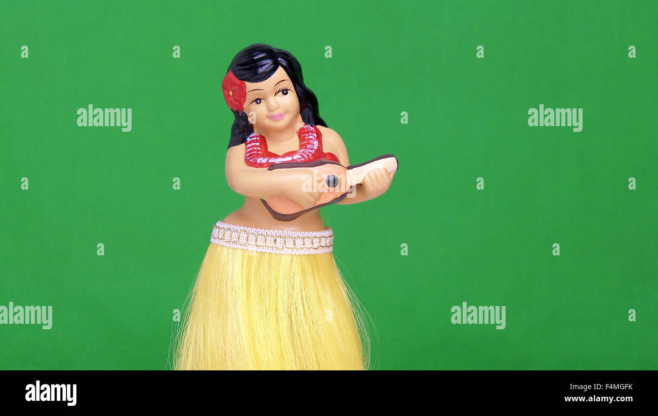 Dancing Hula girl doll against a green screen Stock Photo - Alamy
