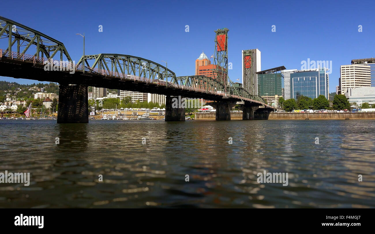 The Hawthorne Bridge crosses over the Willamette River and leads into ...