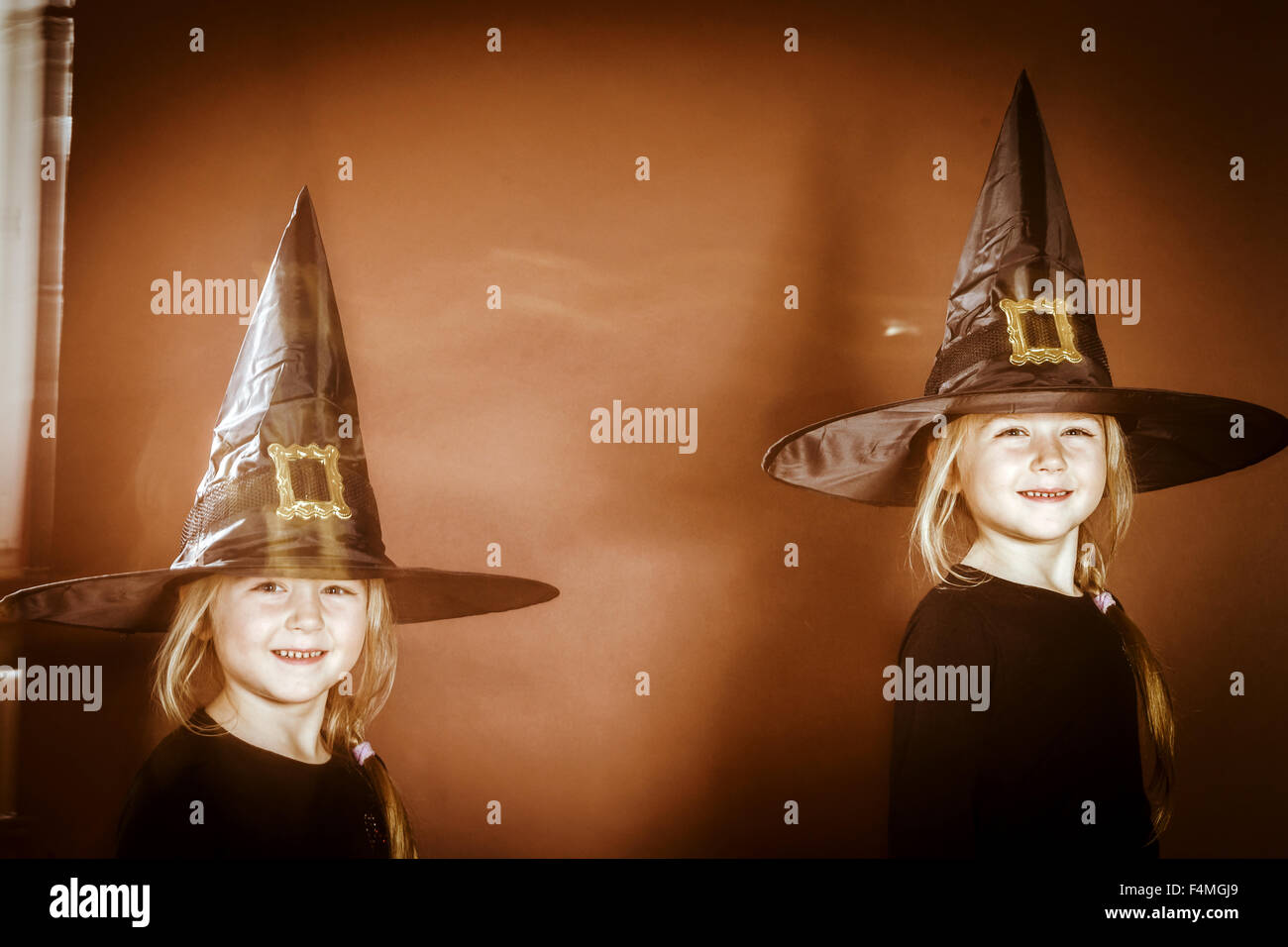 Halloween mystic photo with mixed light. Cute little girl multi ...