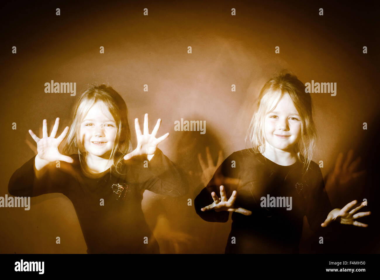 Halloween mystic photo with mixed light. Cute little girl multi ...