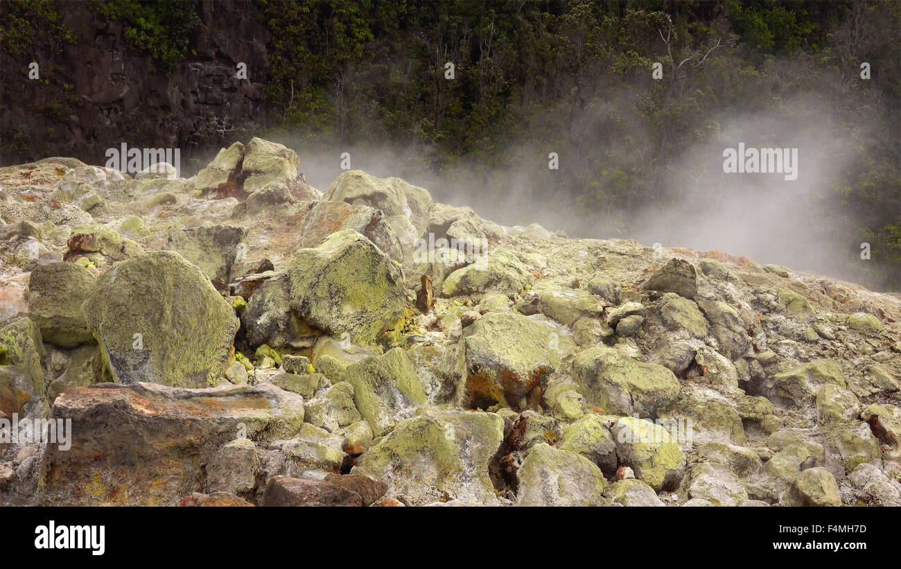 Steam rising from vents between colorful boulders in Hawaii Volcanoes ...