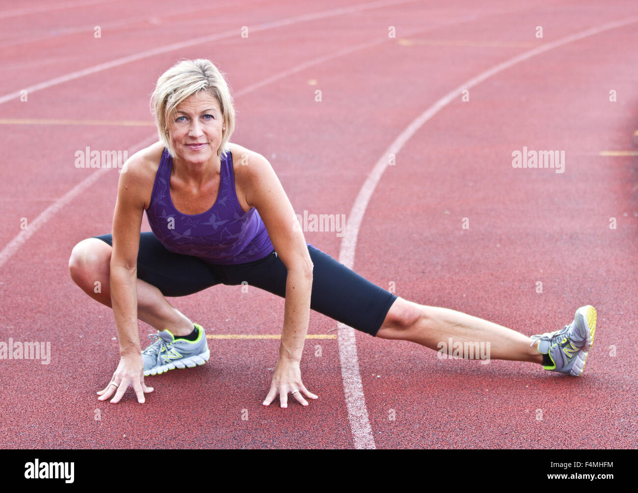 Cute woman is sporty situation on a stadium Stock Photo - Alamy