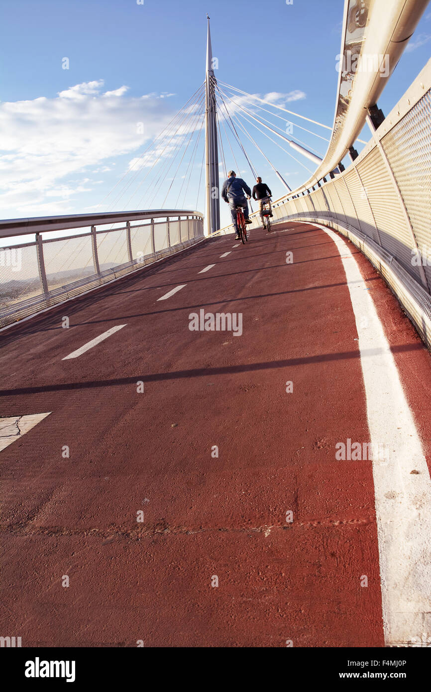 Cyclist on suspension bridge hi-res stock photography and images - Alamy