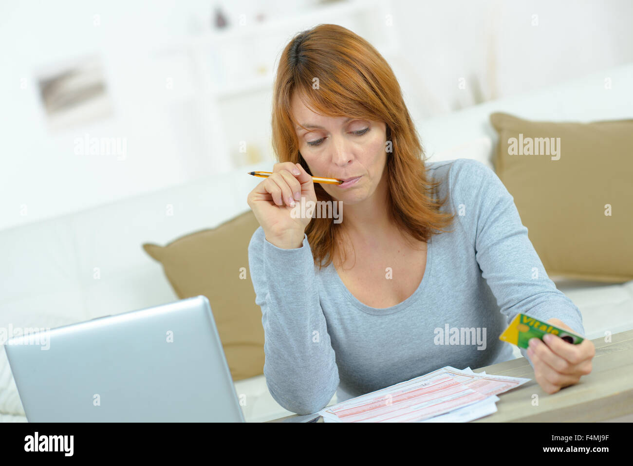 Woman going over her finances Stock Photo - Alamy