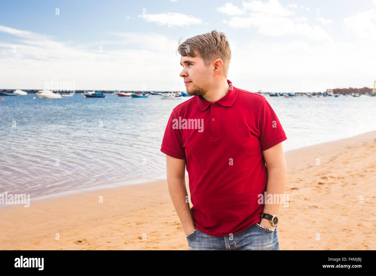 Smiling man at the beach Stock Photo - Alamy